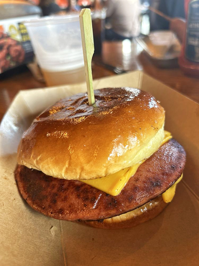 Not your childhood bologna sandwich! This beauty sports a perfectly grilled patty, melty cheese, and a bun with that ideal squish factor that makes you want to high-five the chef.