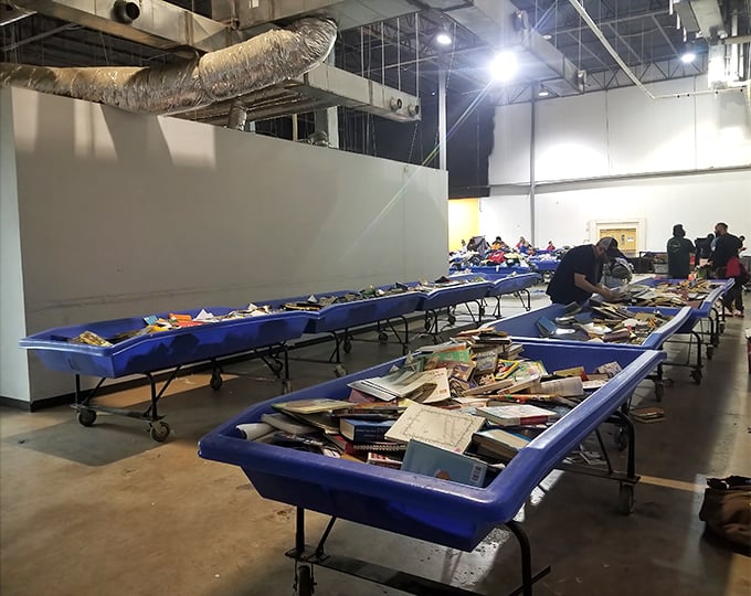 Literary treasures await the patient hunter. These blue bins might contain anything from dog-eared paperbacks to first-edition gems hiding in plain sight.