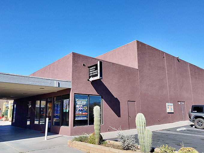 The performing arts center's earthy tones blend seamlessly with the landscape, proving culture thrives even where rainfall doesn't.