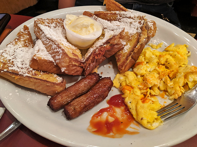 This French toast arrives wearing enough powdered sugar to make Liberace jealous, alongside perfectly scrambled eggs.