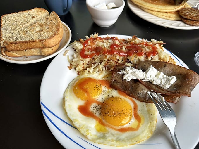 Sunny-side up eggs with that perfect runny yolk, crispy home fries with just the right amount of ketchup&mdash;this is breakfast architecture at its finest.
