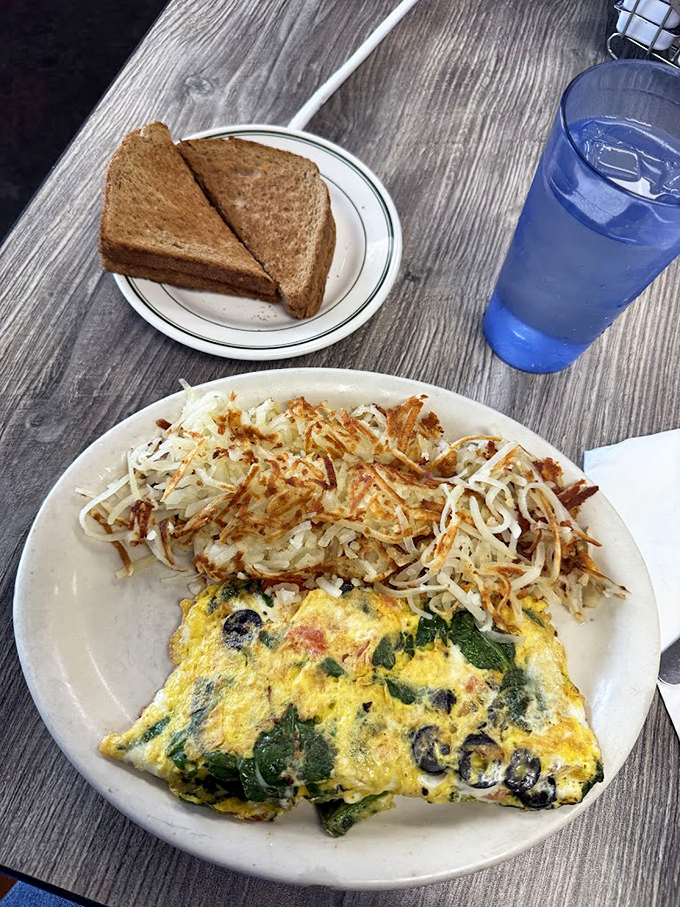 This omelet and hash brown combo looks like what breakfast dreams are made of, seriously.