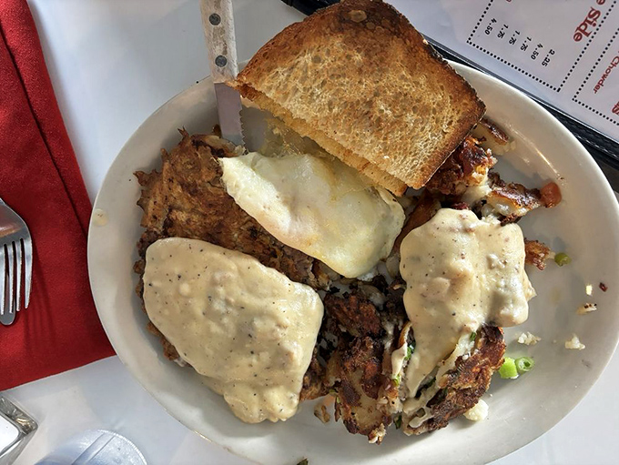 Behold the country breakfast in all its glory&mdash;crispy hash browns, eggs, and gravy forming a holy trinity of morning satisfaction.