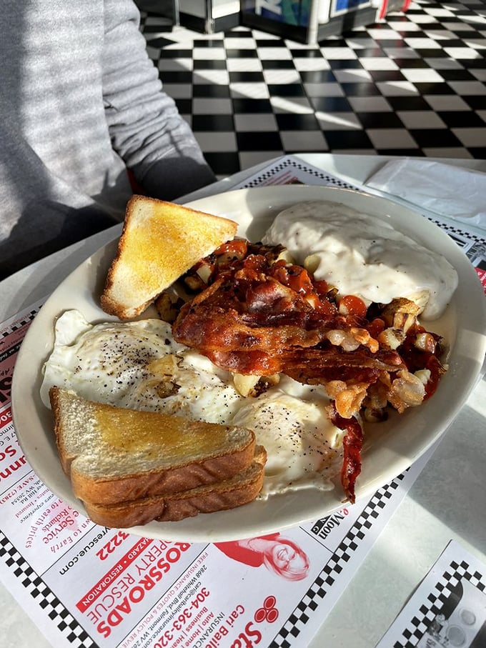 Breakfast nirvana achieved: eggs, bacon, home fries, and toast with a side of nostalgia. This plate doesn't just feed your body &ndash; it hugs your soul.