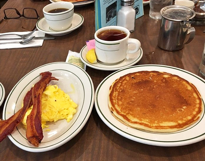 Sometimes perfection is simple: fluffy pancakes, crispy bacon, and scrambled eggs that know their job is making you happy.