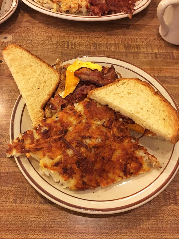 Breakfast nirvana on a plate: Perfectly crispy hash browns, golden toast, and eggs with that ideal balance of crispy edges and runny yolk.