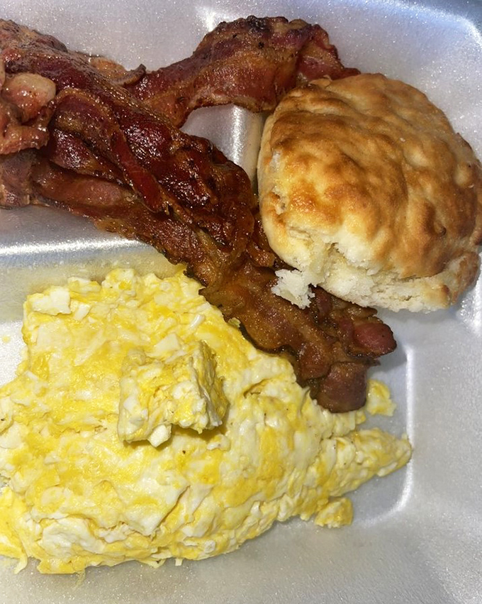Breakfast perfection on a styrofoam plate. That golden biscuit practically begs you to break it open while the eggs whisper, "Good morning!"