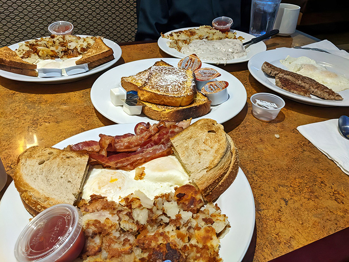 Breakfast spread that would make Ron Swanson weep tears of joy&mdash;crispy home fries, perfectly fried eggs, and French toast dusted with powdered sugar like the first snow of winter.