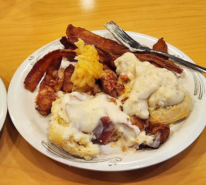 Breakfast nirvana achieved: crispy bacon, creamy gravy, and enough carbs to fuel a marathon. Diet plans come here to die happy deaths.