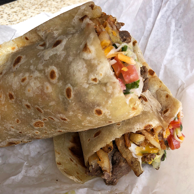 Behold the architectural marvel that is a proper California burrito&mdash;where tortilla engineering meets culinary artistry in perfect harmony.
