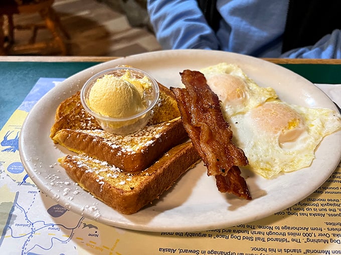 French toast that's achieved the perfect golden-brown exterior, served with crispy bacon and eggs&mdash;the holy trinity of breakfast done absolutely right.