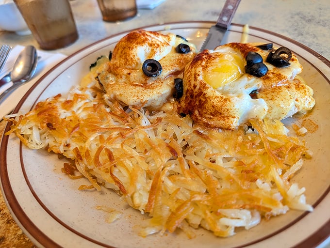 Eggs Benedict with golden hash browns looking like breakfast decided to dress up fancy while staying comfortably casual.