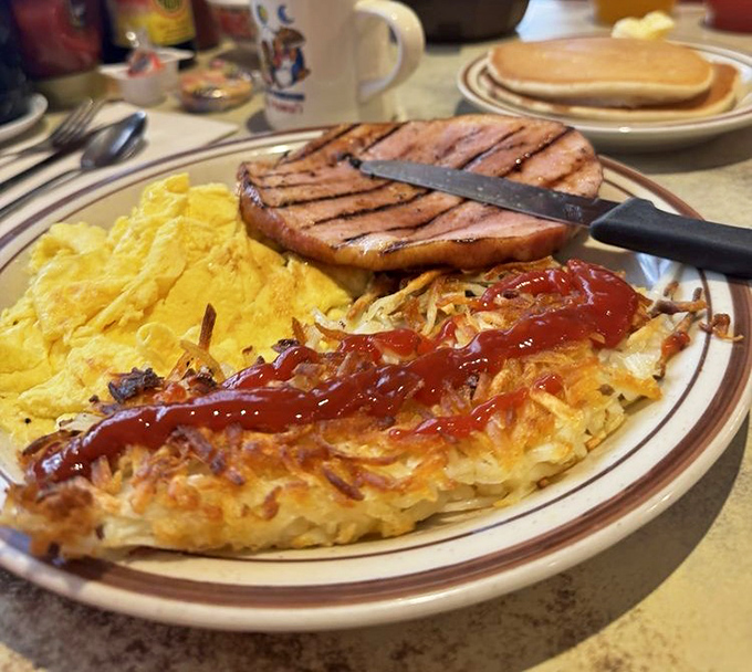 Breakfast perfection on a plate&mdash;crispy hash browns, fluffy scrambled eggs, and that ham steak could convert a vegetarian. Temporarily, at least.