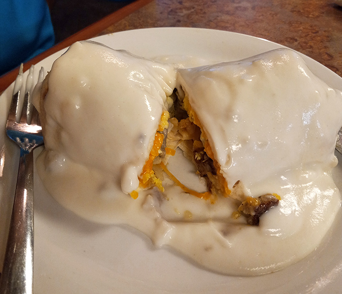 This breakfast burrito isn't just covered in gravy&mdash;it's smothered in possibility. A morning masterpiece that demands a knife and fork.