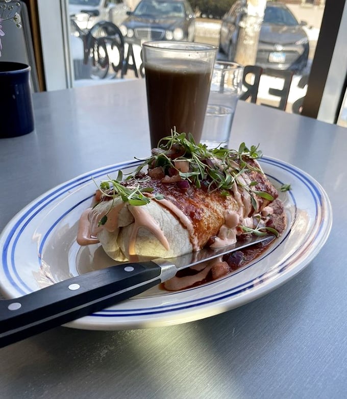 This isn't just a breakfast burrito&mdash;it's edible architecture, a masterpiece of morning ingredients topped with fresh microgreens and a sauce that demands to be savored.