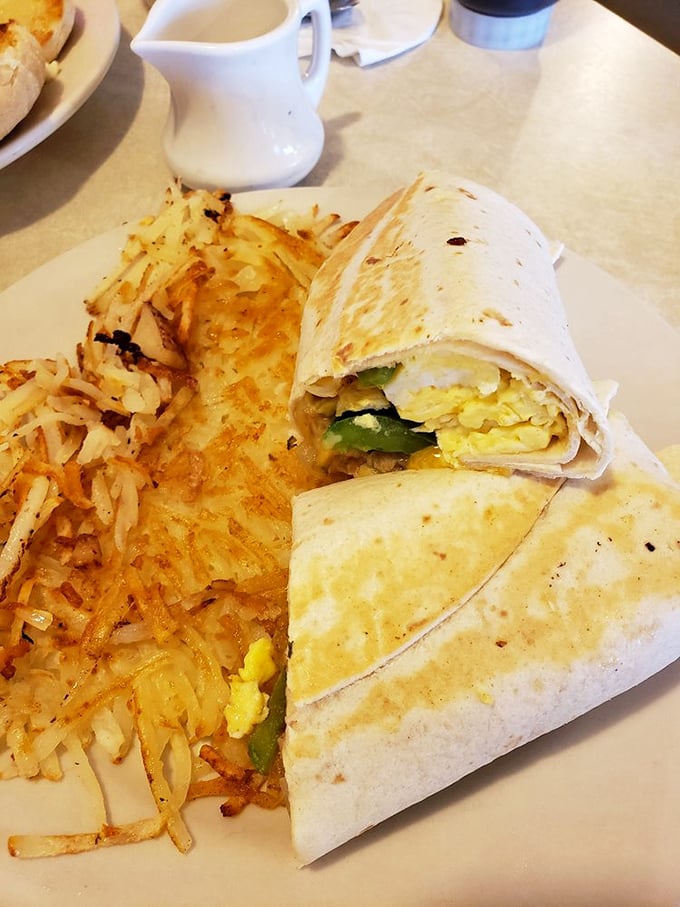 Breakfast burritos: where morning ingredients find their higher purpose wrapped in a tortilla alongside hash browns that actually deserve the name.
