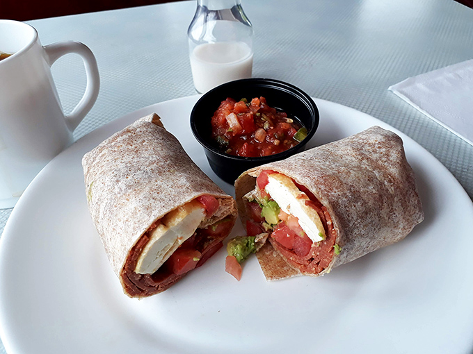 This breakfast burrito isn't just a meal, it's a morning fiesta wrapped in a tortilla, complete with a salsa sidekick.