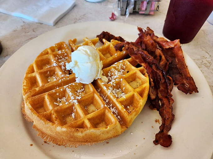 Waffles and bacon performing their morning duet &ndash; crispy, sweet, and utterly shameless about being perfect together.