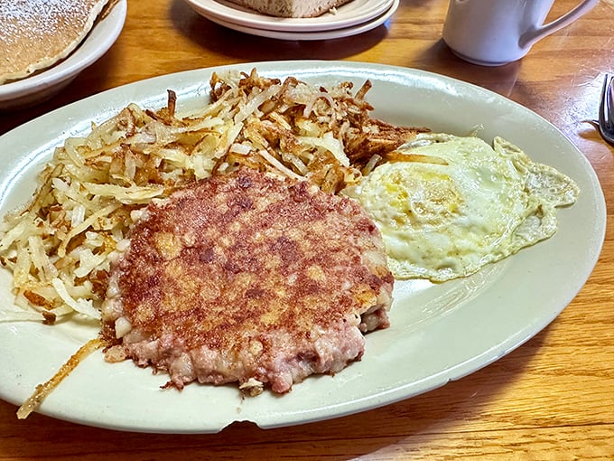 This isn't just breakfast &ndash; it's edible sunshine on a plate, with eggs cooked to perfection alongside crispy home fries that could make a potato proud.