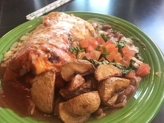 Breakfast burrito nirvana achieved! Perfectly roasted potatoes, melted cheese, and that signature red chile sauce that makes Monday mornings bearable again.