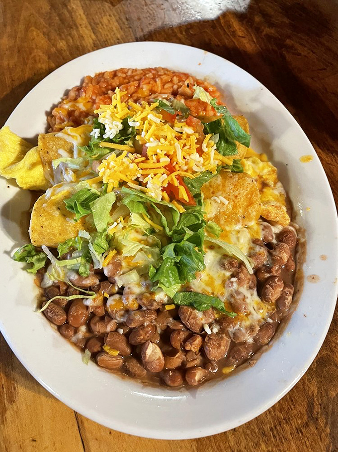 New Mexico's breakfast philosophy in one perfect plate: beans, cheese, chile, and enough toppings to make your taste buds dance the Taos two-step.