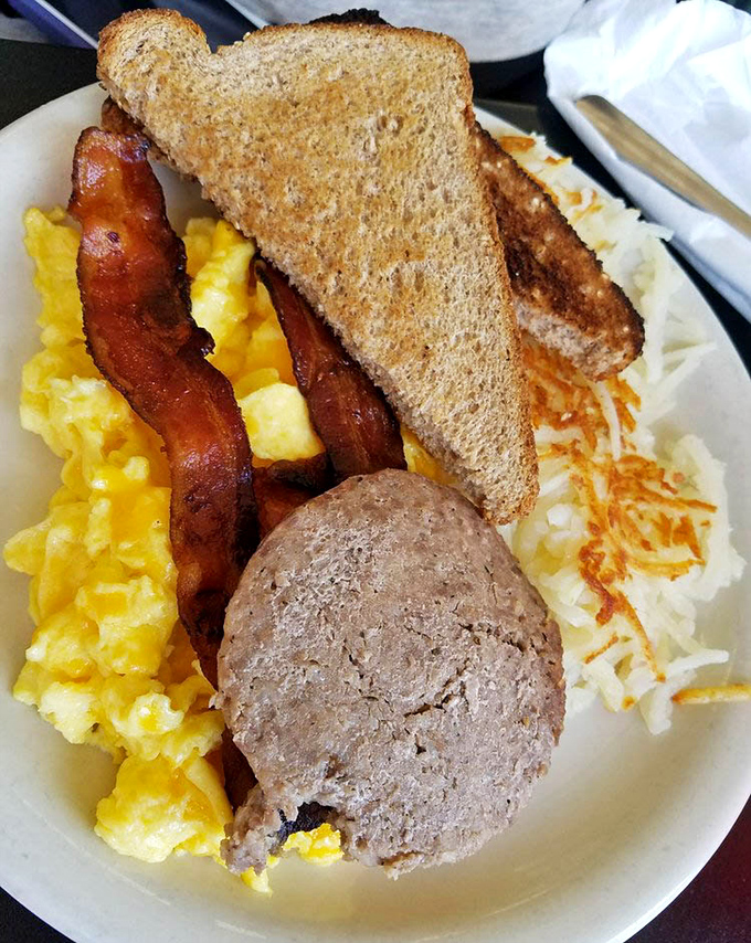 Breakfast perfection on a plate &ndash; scrambled eggs with that ideal fluff factor, bacon with the perfect crisp-to-chew ratio, and hash browns that deserve their own fan club.