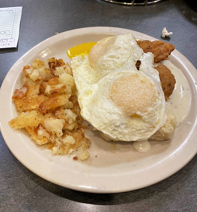Breakfast nirvana: perfectly cooked eggs, golden hash browns with that ideal crisp-to-tender ratio, and a side that makes you question why you'd eat anywhere else.