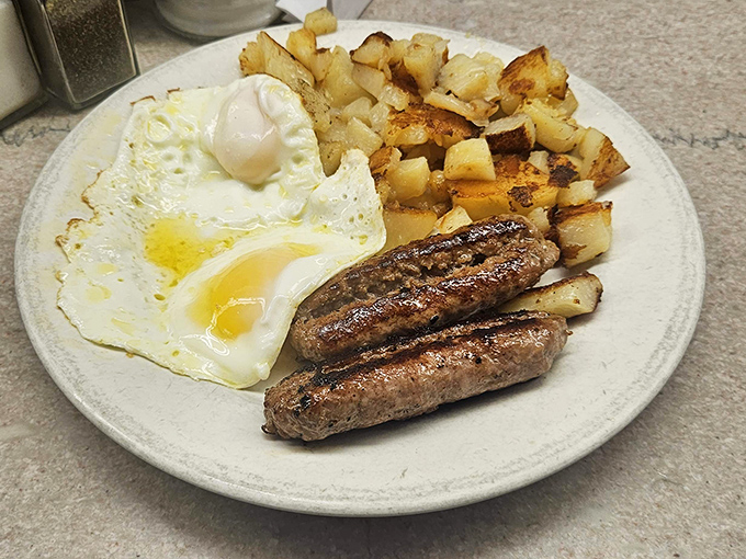 Breakfast perfection doesn't need Instagram filters. Those golden hash browns, perfectly cooked eggs, and sausage links are the morning trilogy that launched a thousand loyal customers.