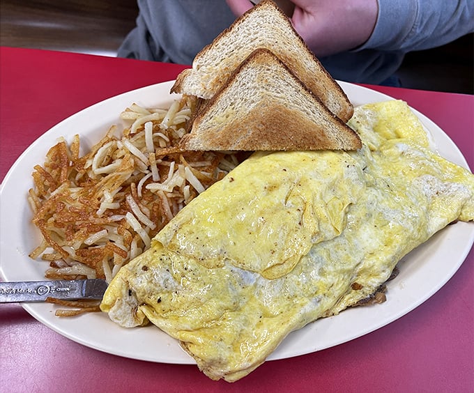 This isn't just an omelet&mdash;it's a golden-hued masterpiece with hash browns crispy enough to make a potato proud.