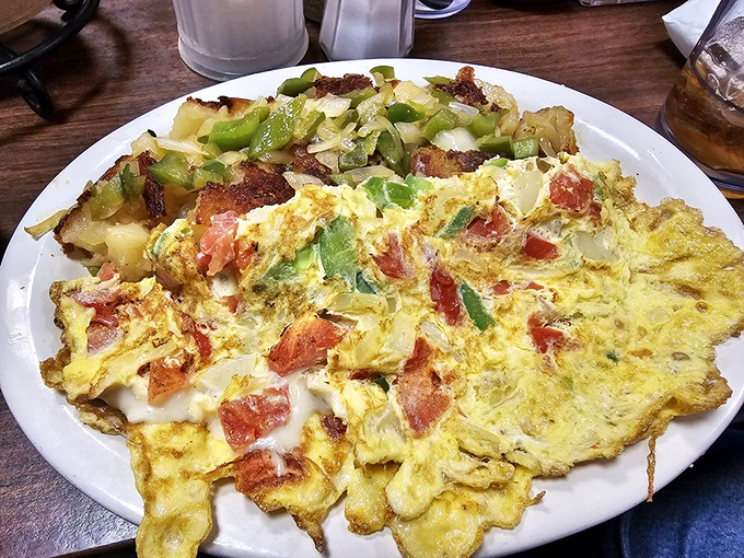 This omelet doesn't just contain vegetables&mdash;it showcases them. Those home fries look like they've earned a PhD in crispiness.