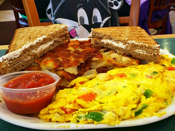 This breakfast plate is the morning equivalent of a standing ovation &ndash; vibrant vegetables dancing through perfectly scrambled eggs alongside crispy home fries.