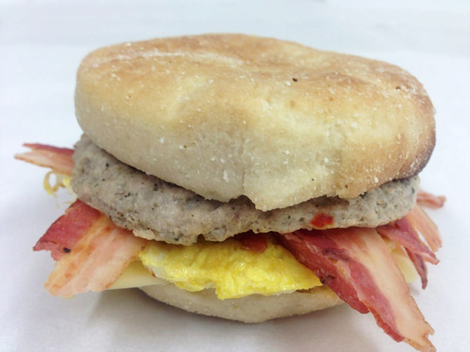 Breakfast architecture at its finest &ndash; a perfectly constructed sandwich where every layer deserves its own thank-you note.