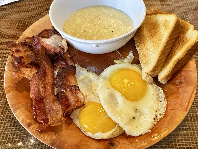 Two sunny-side-up eggs, perfectly crisp bacon, and grits that would make your grandmother nod in approval. Breakfast doesn't get more honest than this.