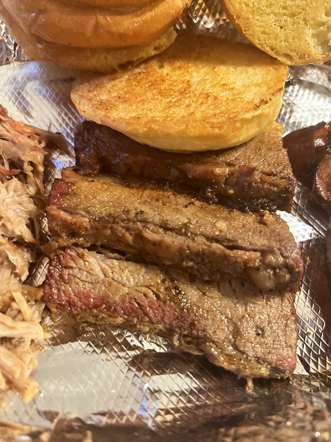 Behold the brisket &ndash; with that perfect smoke ring and bark that would make tree trunks jealous. This isn't food; it's edible poetry.