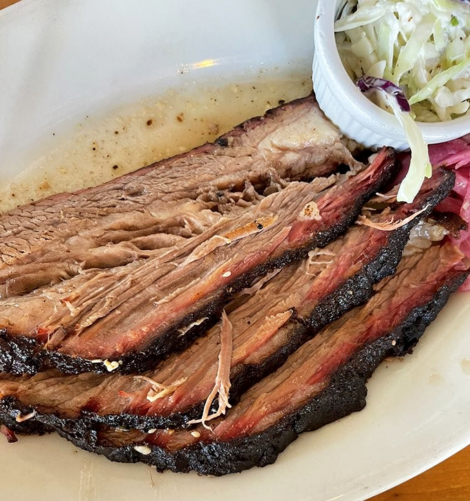 This brisket's smoke ring and bark could make a vegetarian reconsider their entire life philosophy in one bite.
