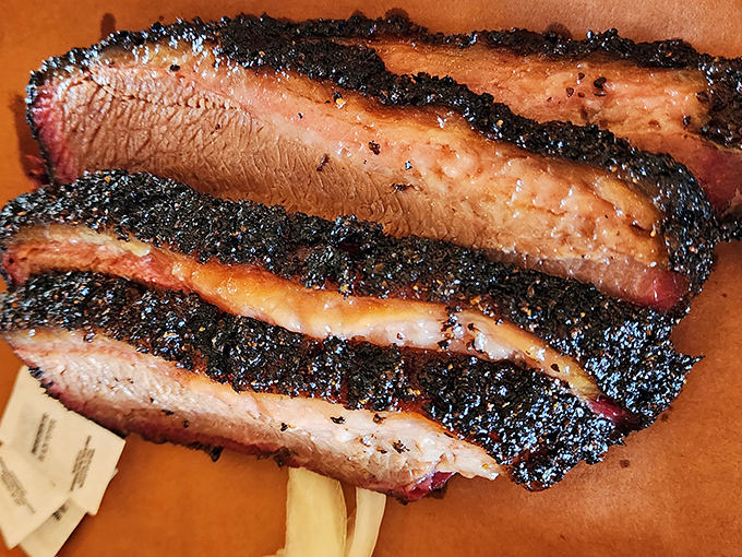 Brisket with a bark so perfect it should be in a barbecue museum. That smoke ring isn't just pink; it's practically blushing from all the attention.