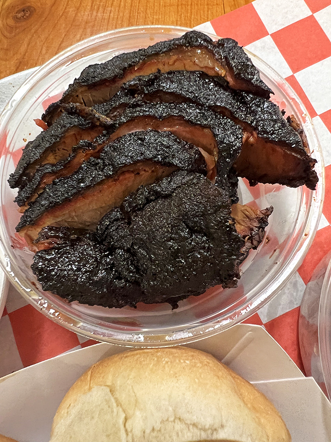 Behold the legendary brisket &ndash; bark so perfect it should be in a museum. That smoke ring is nature's way of saying "good things come to those who wait."