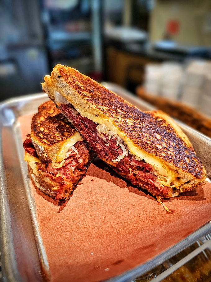 Behold the brisket grilled cheese in all its glory &ndash; crispy bread embracing tender smoked meat and melted cheese perfection.