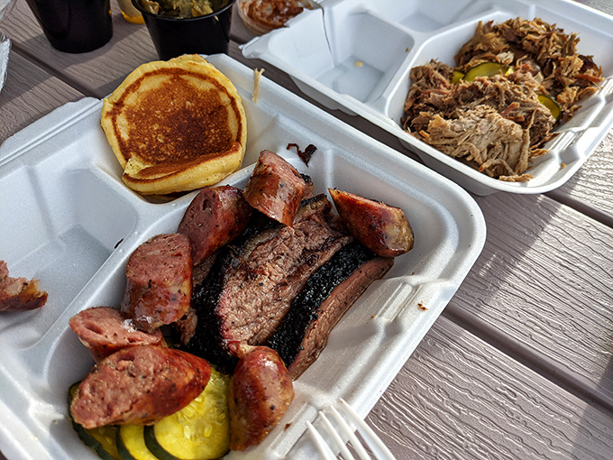 Meat candy in its natural habitat. That smoke ring on the brisket is the BBQ equivalent of a Rolex &ndash; a sign of true craftsmanship.