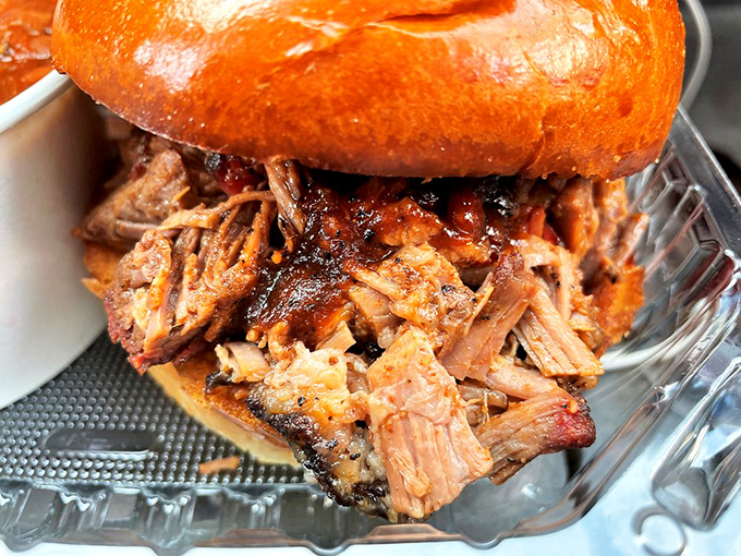 This isn't just a sandwich; it's a structural engineering marvel of tender brisket threatening to escape its brioche prison.