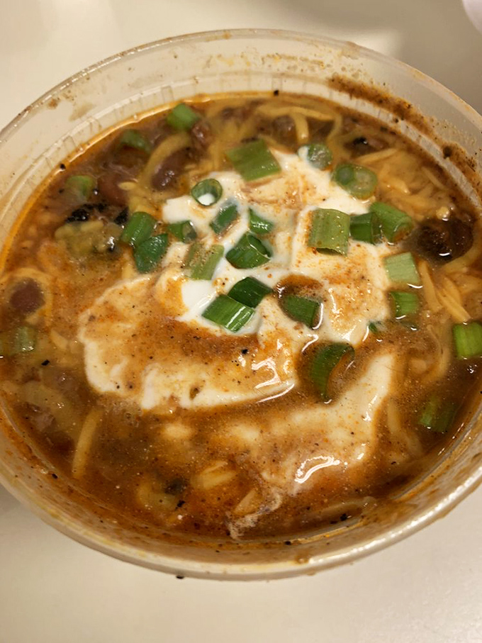 This isn't just brisket chili&mdash;it's a warm hug in a bowl, topped with a dollop of sour cream and green onions for good measure.
