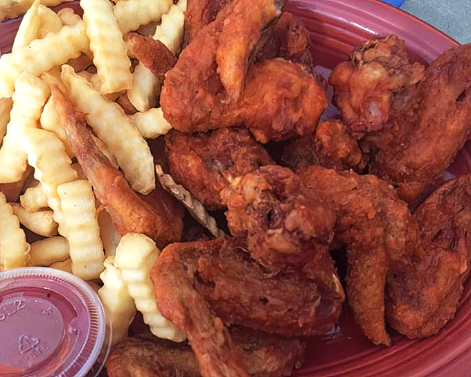 Golden-brown broasted chicken wings nestled against crinkle-cut fries&mdash;a combination so perfect it should have its own national holiday. 