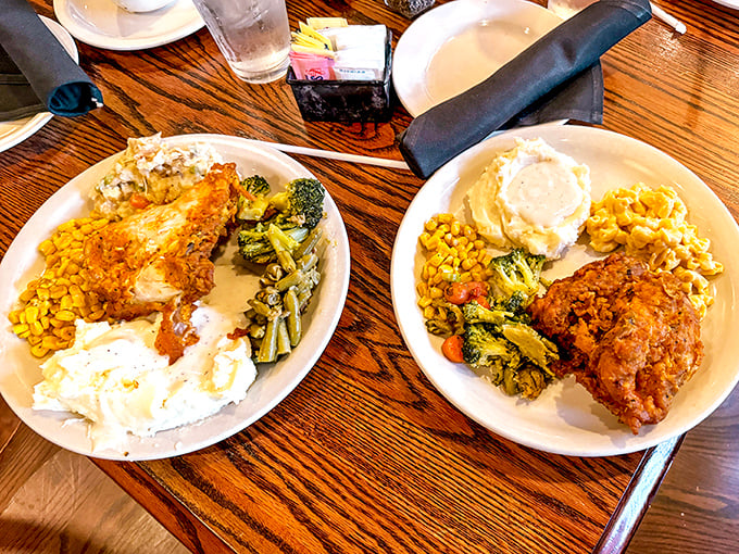 Golden-brown chicken, creamy mashed potatoes, and colorful vegetables arranged on plates like a Southern still life painting that's about to disappear faster than free samples.
