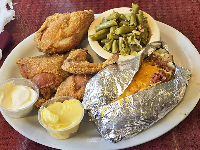 This isn't just dinner&mdash;it's a Midwestern security blanket: golden fried chicken, country-style green beans, and a baked potato wrapped in foil like a gift.