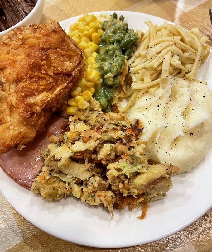 A plate that tells the story of Amish cooking: golden fried chicken, buttery noodles, and vegetables that somehow make you forget you're eating something healthy.