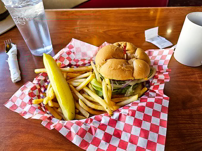 This burger doesn't just sit on the plate&mdash;it commands attention like a diva on opening night, with those golden fries playing a perfect supporting role.