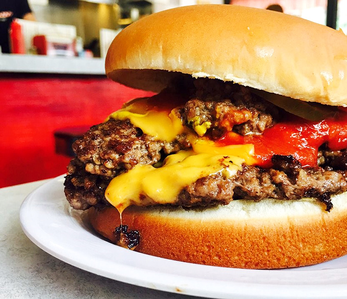 This isn't just a cheeseburger—it's edible history, with cheese melting into beef patties that have been perfected over nine decades.