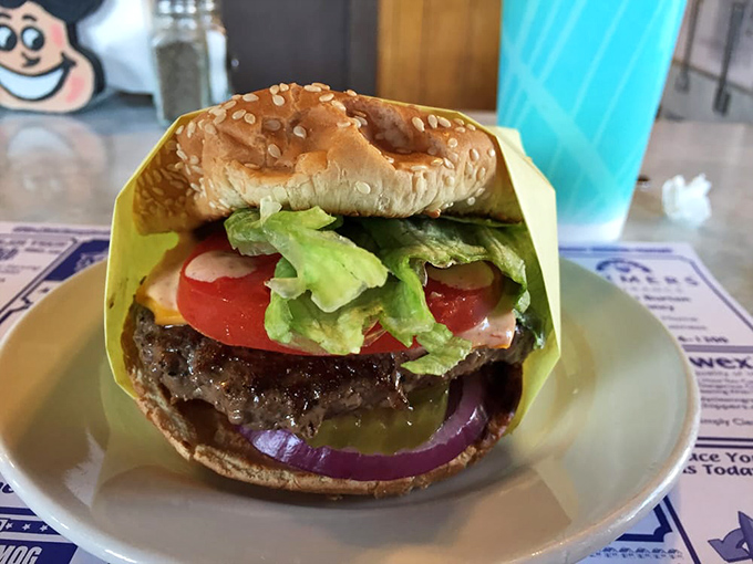 This isn't just a burger; it's edible architecture with structural integrity that would make Frank Lloyd Wright weep with joy.