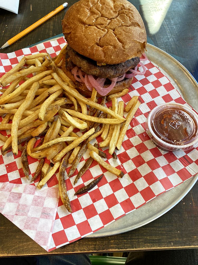 This isn't a dainty, one-handed affair. The signature burger demands your full attention and possibly a strategic eating plan.