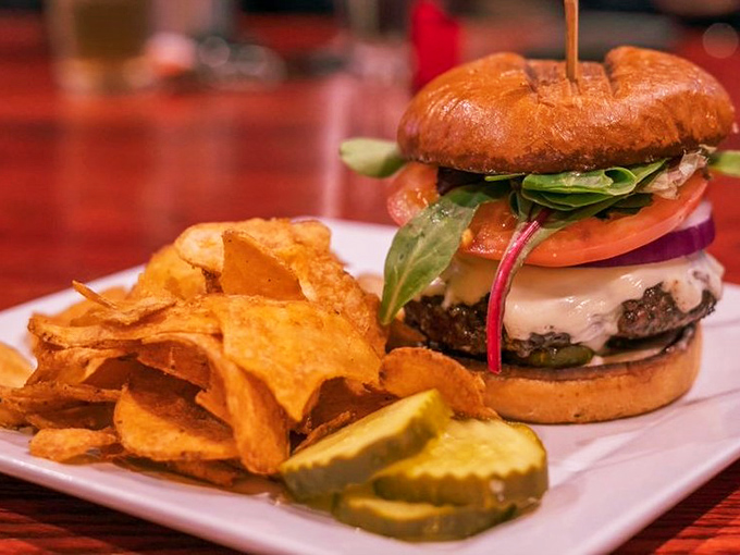 Burger perfection doesn't happen by accident. This towering beauty with fresh toppings and golden chips might just ruin all other burgers for you.